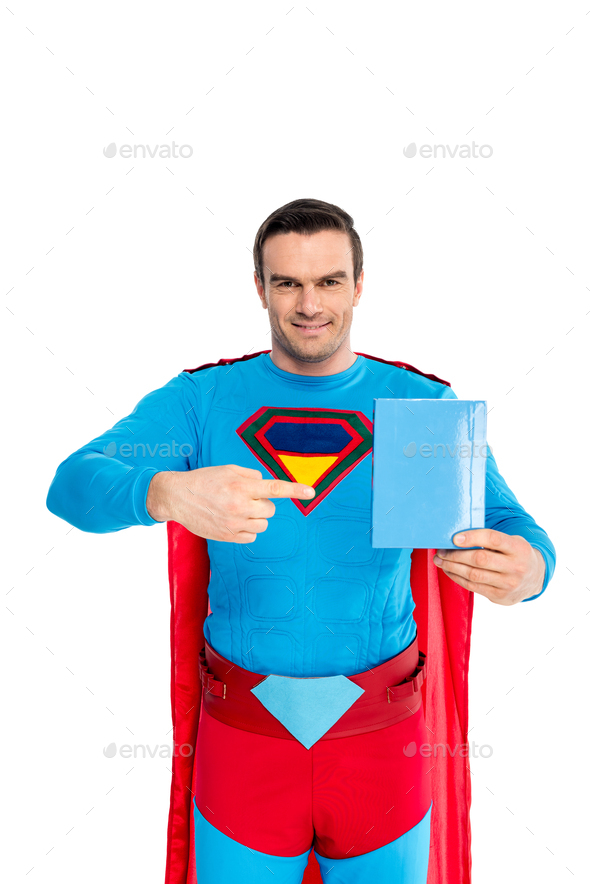 handsome superman pointing with finger at blank box with soap powder ...