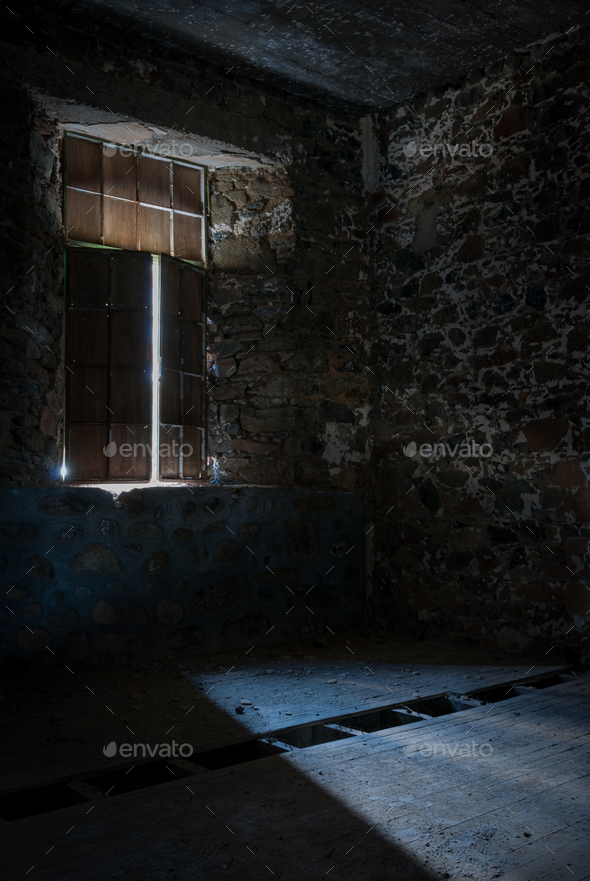 Empty abandoned creepy deserted room with bright sun lights entering ...