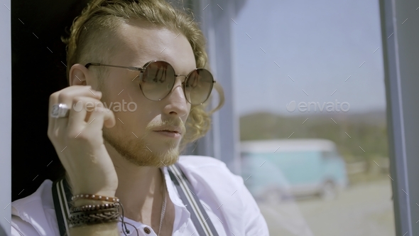 Stylish man with glasses is looking. Action. Stylish man with hairstyle ...