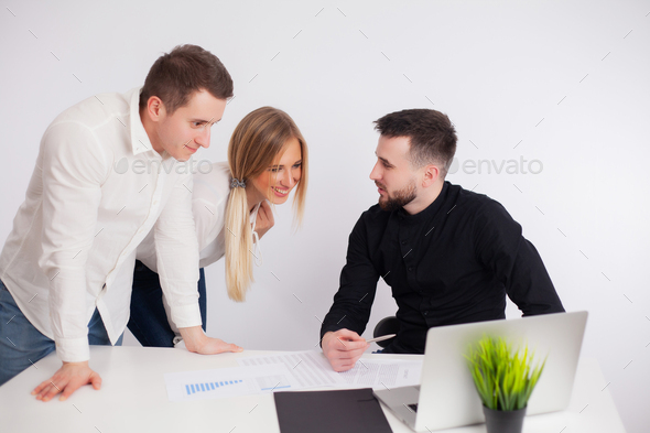 Team of employees working together on a joint project Stock Photo by ...