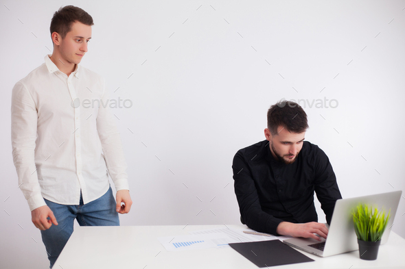 Team of employees working together on a joint project Stock Photo by ...
