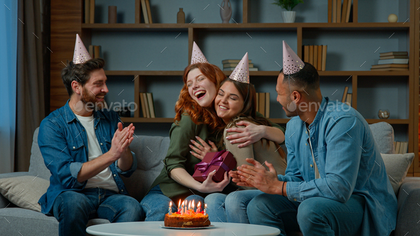 Excited woman receive gift present from friends diverse multiracial ...