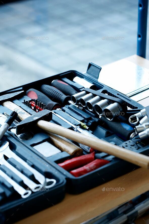 Vertical shot of a set of tools in a case Stock Photo by wirestock