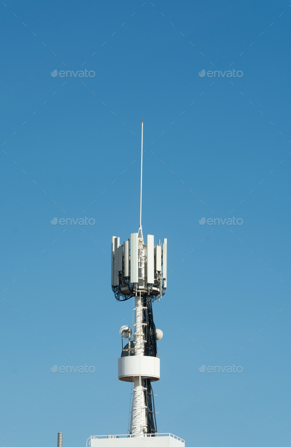 Vertical shot of a cell tower on background of the clear blue sky Stock ...