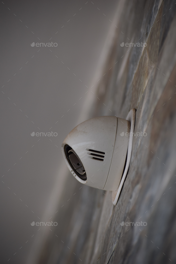 Vertical shot of a modern CCTV security camera on the wall Stock Photo ...