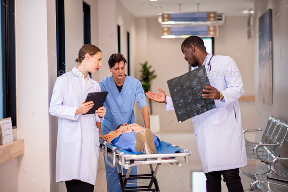 medic running with gurney along hospital corridor Stock Photo by ...