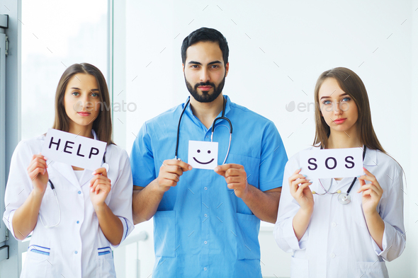 Doctor holding a card with Symbol Smile. Help and Sos, Medical concept ...