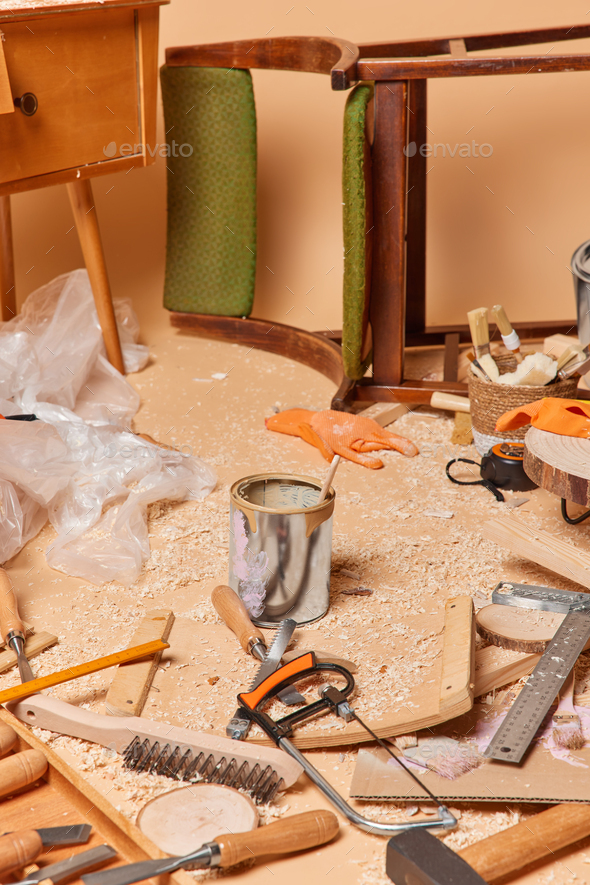Woodwork workshop with variety of instruments and old broken furniture ...