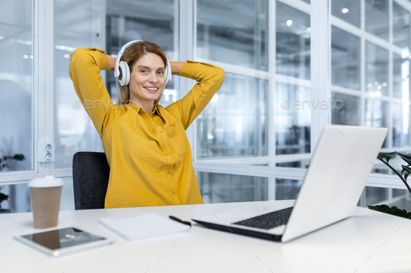 Portrait of happy female programmer inside office, female worker with ...