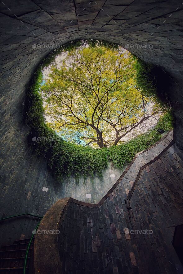 Spiral staircase at Fort Canning Park, Singapore Stock Photo by wirestock