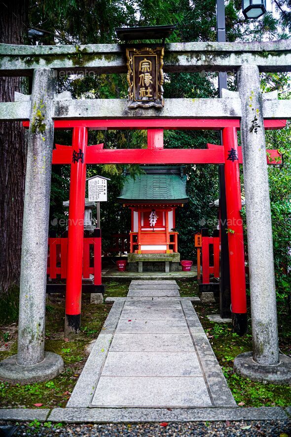 Vertical shot of torii traditional japanese gate at the entrance of a Shinto shrine Stock Photo ...