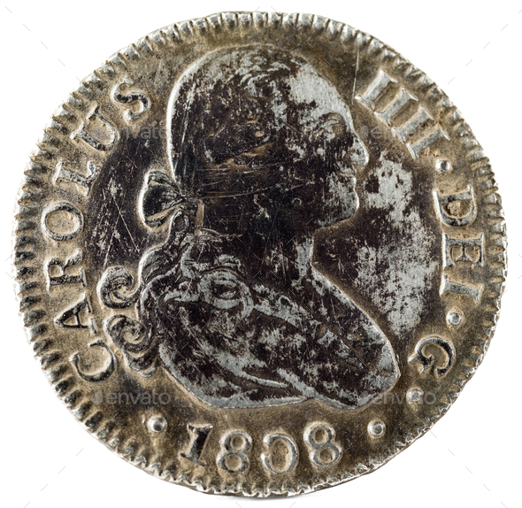 Ancient Spanish silver coin of the King Carlos IV isolated on a white ...