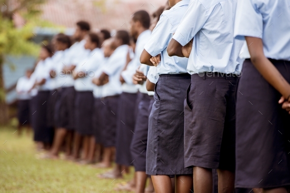 Shallow focus shot of people wearing the same uniform and standing in a ...