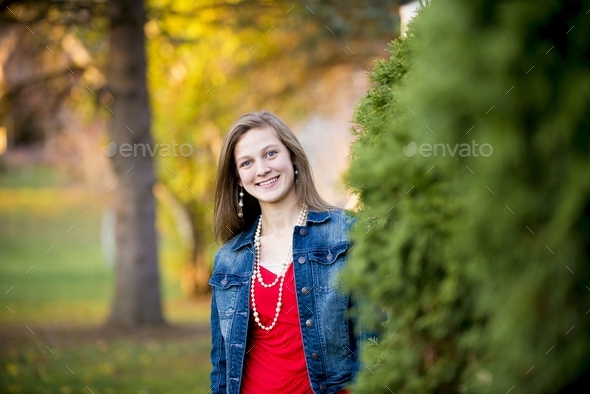 Shallow focus shot of a beautiful female smiling at the camera Stock ...