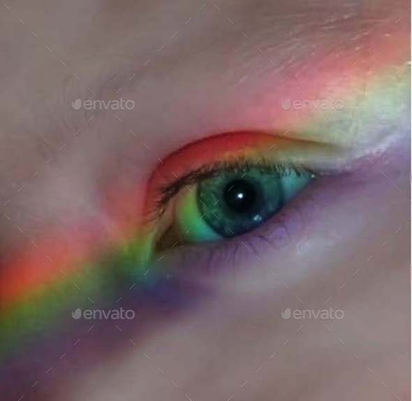Vertical shot of the real rainbow on a blue female eye - seeing the ...