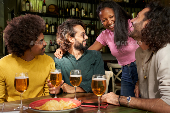 Multiracial group photo smiling friends gathered at restaurant bar ...