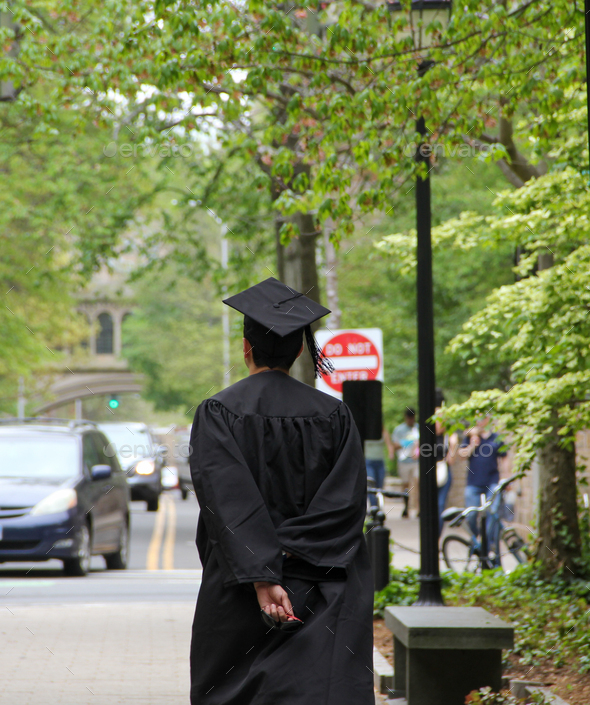 Male Wearing Graduation Attire Cap with Tassel and Gown Regalia on ...