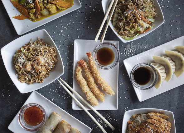 Variety of Chinese food on the restaurant table Stock Photo by jcalvera