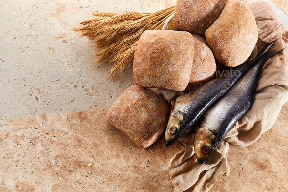 Catholic still life of five loaves of bread and two fish Stock Photo by ...