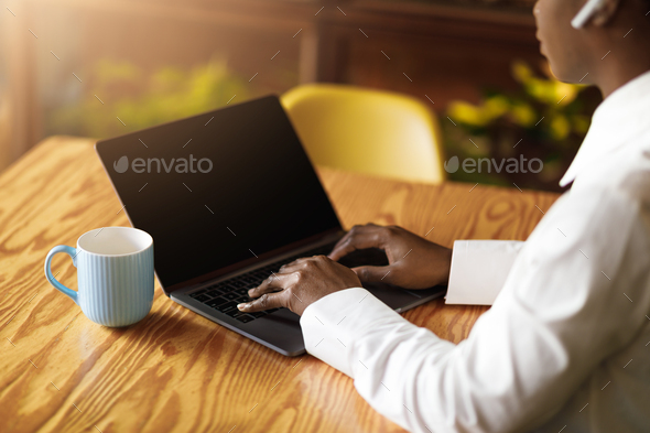Black woman typing on laptop with blank screen, cropped, mockup Stock ...