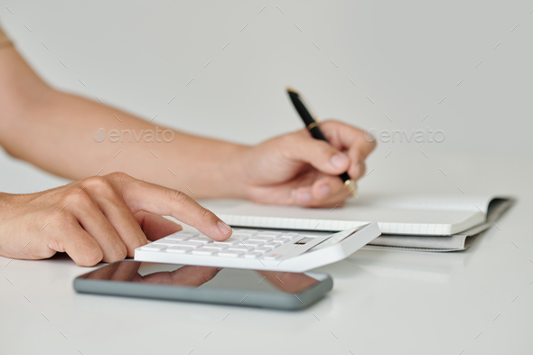 Businessman Making Calculations Stock Photo by DragonImages | PhotoDune