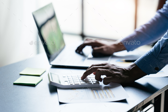 Business team reviewing a diagram or chart and financial reports Stock ...