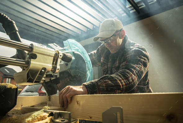 Woodwork Construction Job Using Powerful Equipment Stock Photo by duallogic