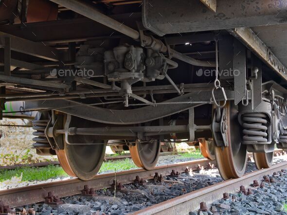 Underside of a train wagon on rails Stock Photo by wirestock | PhotoDune