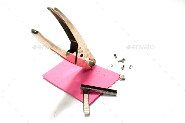Special tool for taking out staples from a paper isolated on the white ...