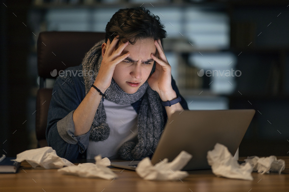 Exhausted sick young man worker staying in the office Stock Photo by ...
