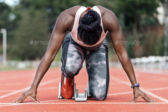Athlete sprinter in starting position Stock Photo by nunezimage | PhotoDune