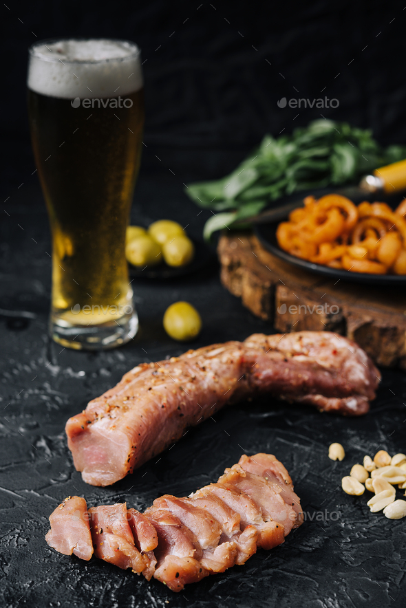 Beer appetizers set with glass of beer Stock Photo by AntAlexStudio