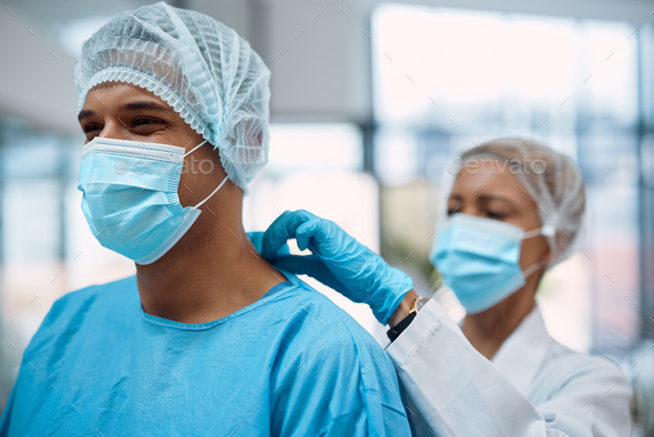 Surgeon team, doctors and surgery with face mask and health, help with ...