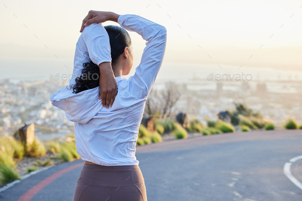 Fitness, stretching and arm by woman rear view in road for running ...