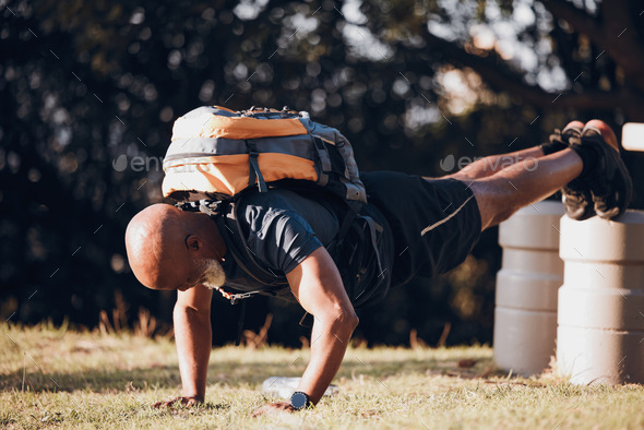 Pushup, strong and black man at a fitness bootcamp for exercise ...