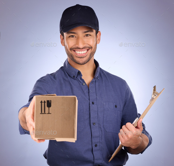 Portrait of delivery man giving box isolated on studio background for ...