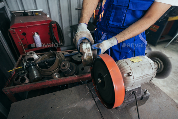 Hand of mechanic worker or metalworker using metal lathe machine Stock ...