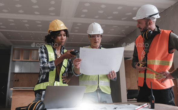 Civil engineer teams meeting working together wear worker helmets ...