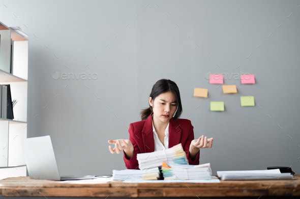 business woman sitting at work stressed , out working hard Feeling ...