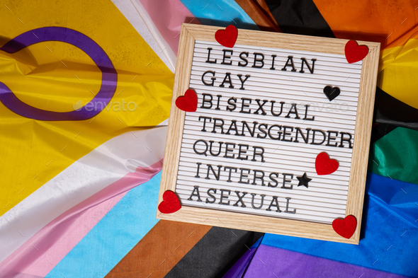 LGBTQIA description frame on Rainbow LGBTQIA flag made from silk ...