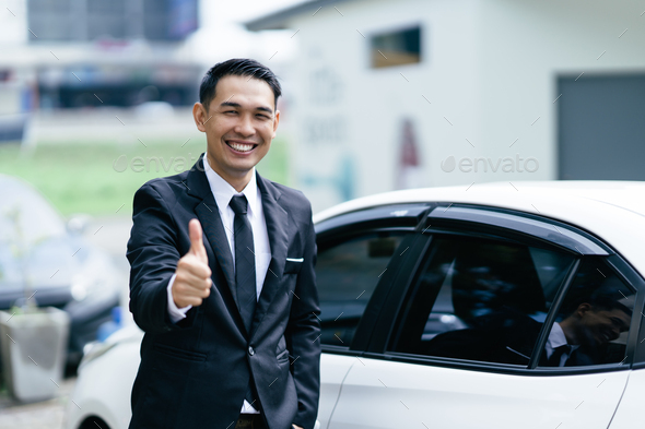 Car dealer man. Auto dealership and rental concept. Stock Photo by paegagz