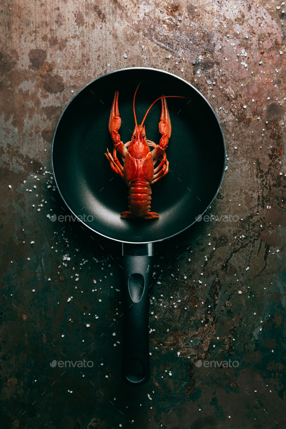 top view of frying pan with crayfish on grungy tabletop with salt Stock ...