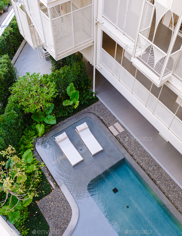 swimming pool at an art deco luxury hotel architecture from the 80s ...
