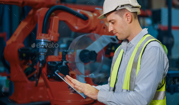 Programming robot controller, Programming robotic arms in factory industrial Stock Photo by 1footage