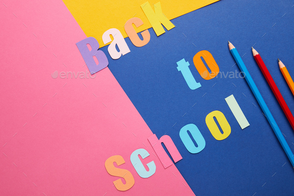 back to school lettering with pencils on creative paper background ...