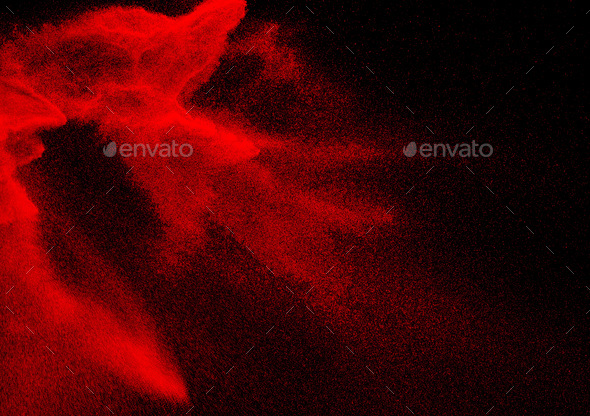 Red dust particles explosioon on black background.Red powder splash ...