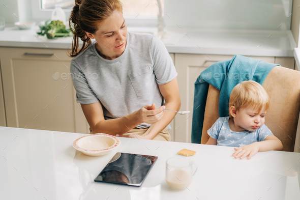 Little girl doesn't want to eat porridge. Child refusing to eat. Stock ...