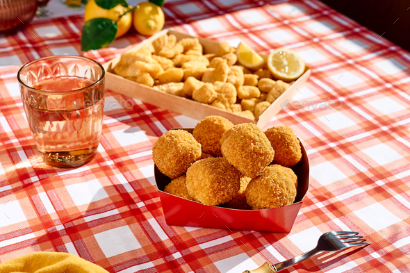 Typical Sicilian street food arancini (deep fried rice balls with meat ...