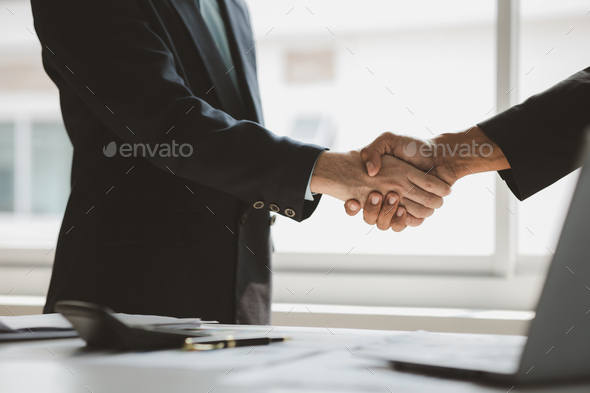 Business investor group holding hands, Two businessmen are agreeing on ...