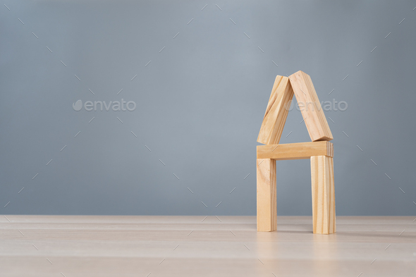 House model built with jenga blocks Stock Photo by kenishirotie | PhotoDune